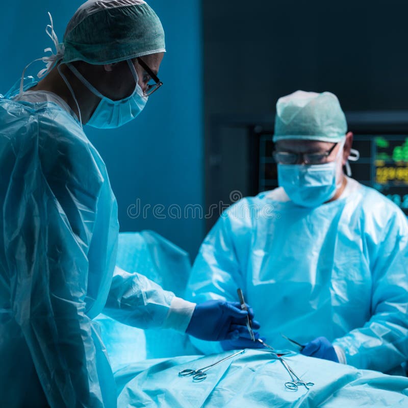Team of Medical Doctors Performs Surgical Operation in Modern Operating ...
