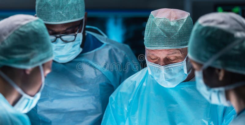 Team of Medical Doctors Performs Surgical Operation in Modern Operating ...
