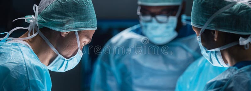 Team of Medical Doctors Performs Surgical Operation in Modern Operating ...