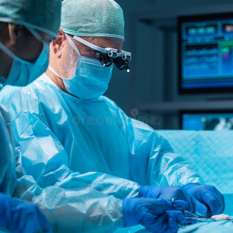 Team of Medical Doctors Performs Surgical Operation in Modern Operating ...