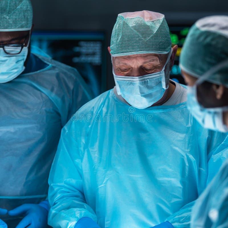 Team of Medical Doctors Performs Surgical Operation in Modern Operating ...