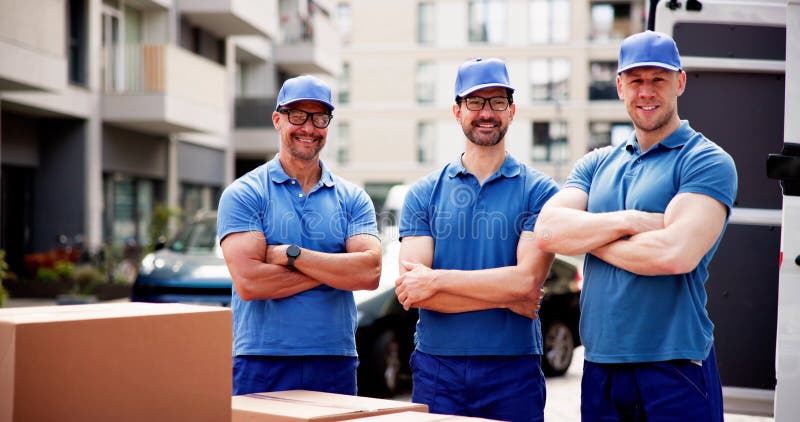 Diverse Team of Professional Movers Delivering Boxes Stock Photo ...