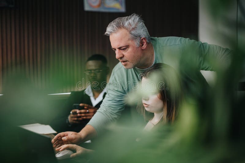 Diverse Team of Professionals Collaboratively Working on a Project in a ...