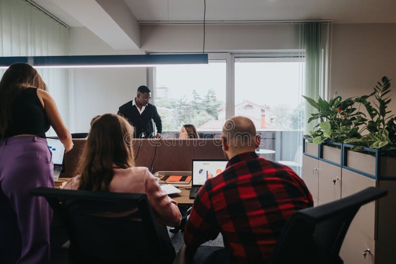 Diverse Team of Professionals Engaging in a Collaborative Discussion in ...