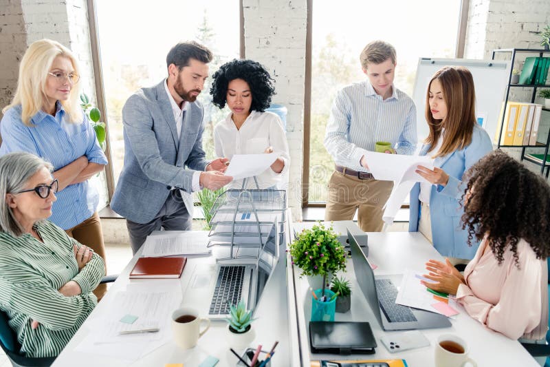 Diverse Group of Professionals Collaborate in a Modern Office Setting ...