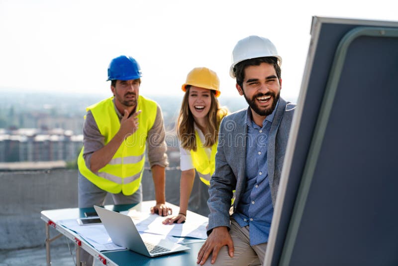 Diverse Team of Specialists with Computer on Construction Site ...