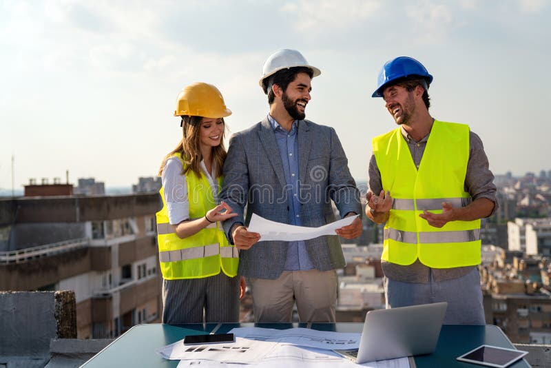Diverse Team of Specialists with Computer on Construction Site ...