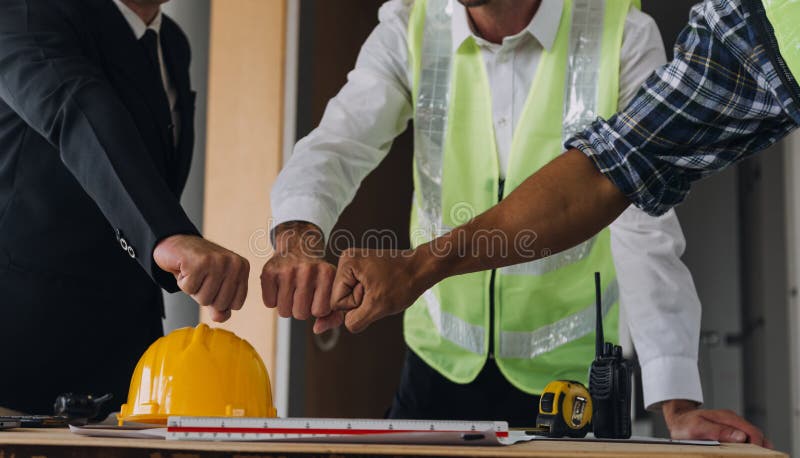 Diverse Team of Specialists Use Tablet Computer on Construction Site ...