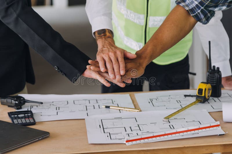 Diverse Team of Specialists Use Tablet Computer on Construction Site ...