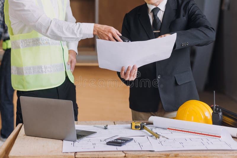 Diverse Team of Specialists Use Tablet Computer on Construction Site ...