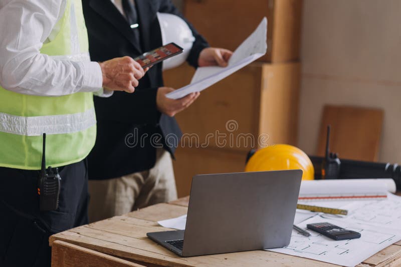 Diverse Team of Specialists Use Tablet Computer on Construction Site ...