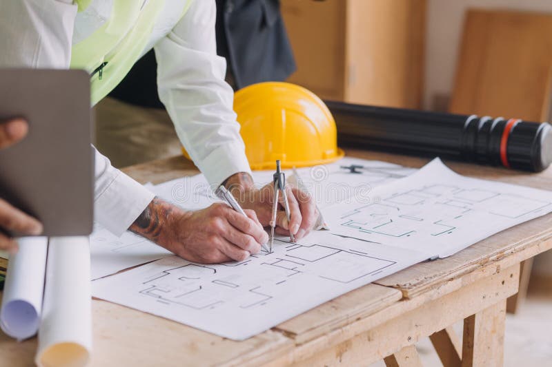 Diverse Team of Specialists Use Tablet Computer on Construction Site ...