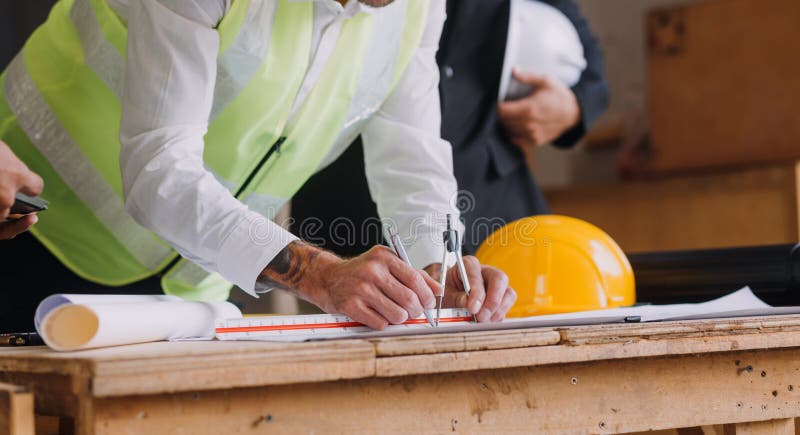 Diverse Team of Specialists Use Tablet Computer on Construction Site ...