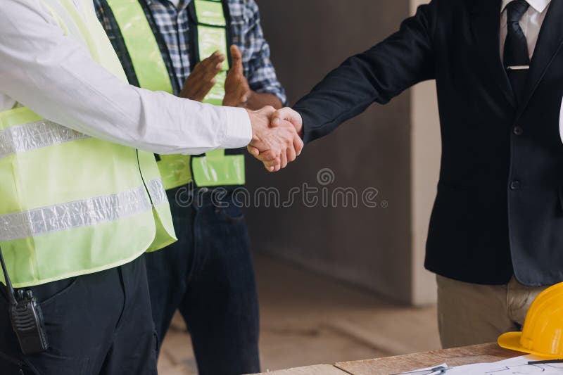 Diverse Team of Specialists Use Tablet Computer on Construction Site ...