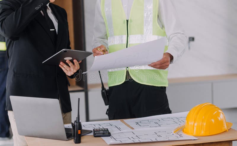 Diverse Team of Specialists Use Tablet Computer on Construction Site ...