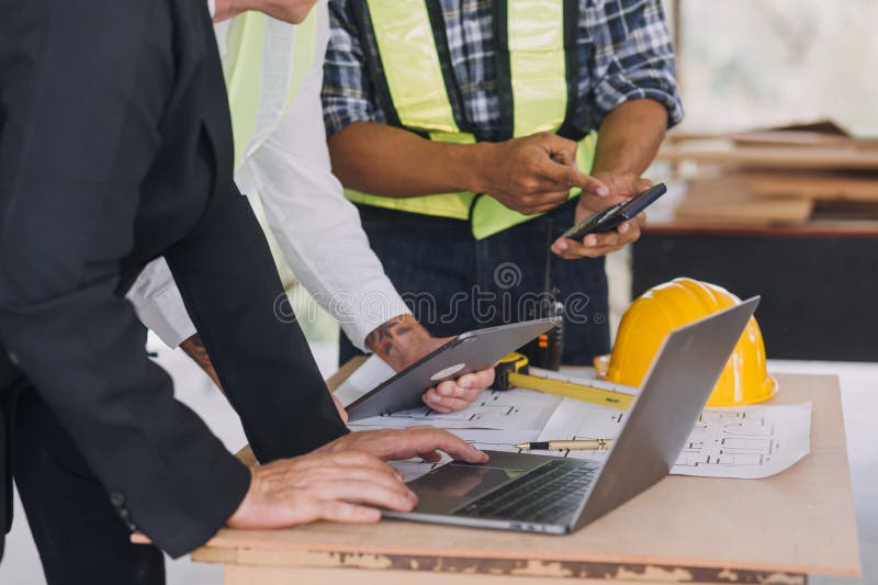 Diverse Team of Specialists Use Tablet Computer on Construction Site ...
