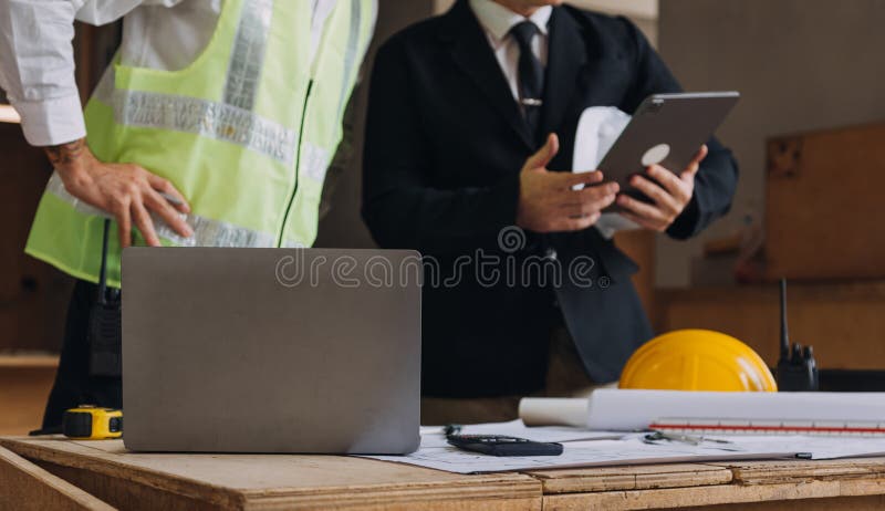 Diverse Team of Specialists Use Tablet Computer on Construction Site ...