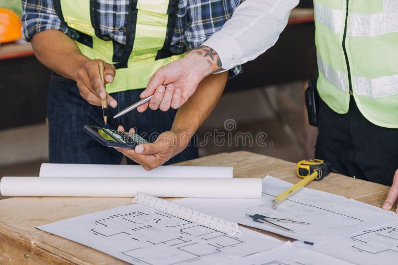 Diverse Team of Specialists Use Tablet Computer on Construction Site ...