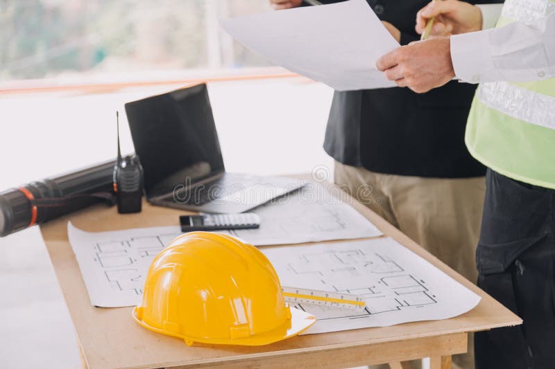 Diverse Team of Specialists Use Tablet Computer on Construction Site ...