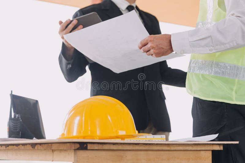 Diverse Team of Specialists Use Tablet Computer on Construction Site ...