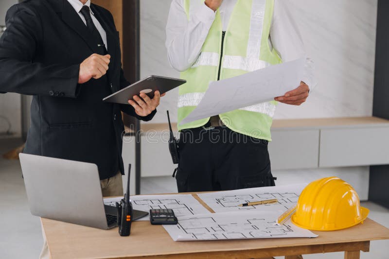 Diverse Team of Specialists Use Tablet Computer on Construction Site ...