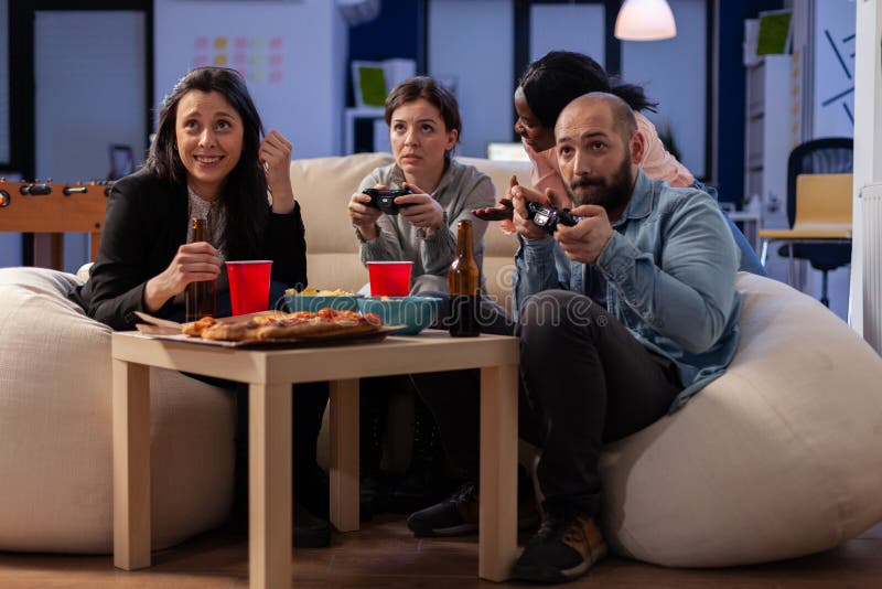 Diverse Team of Workers Playing Console Game on Tv at Office Stock ...