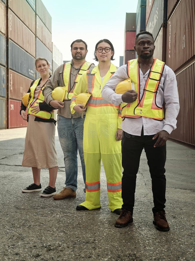 Diverse Team of Workers Standing in Front of Containers Stock Photo ...