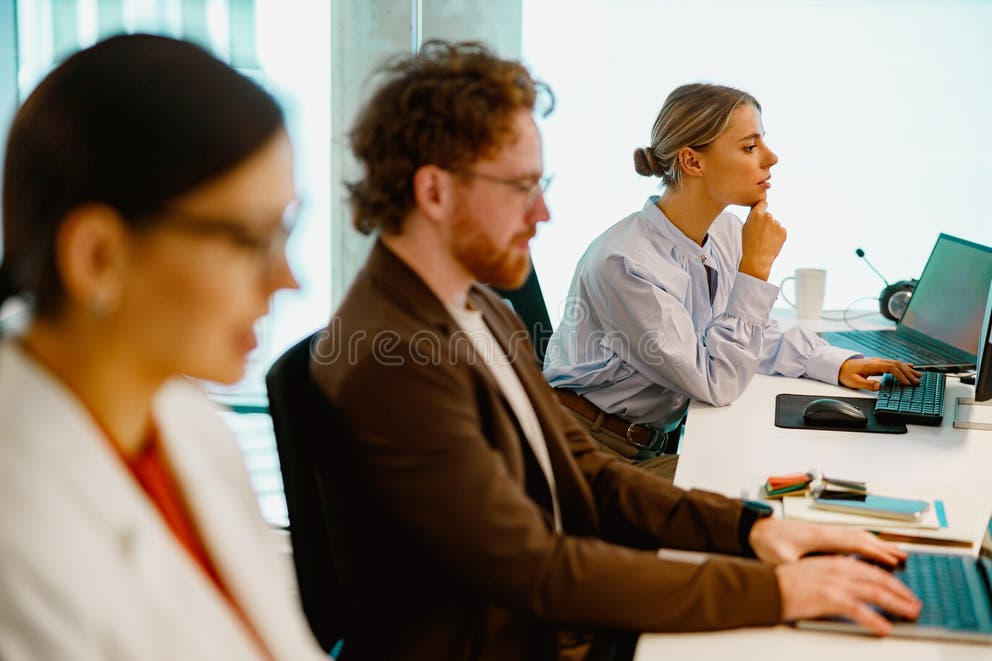 A Diverse Team Working Together Collaboratively in a Modern Office ...