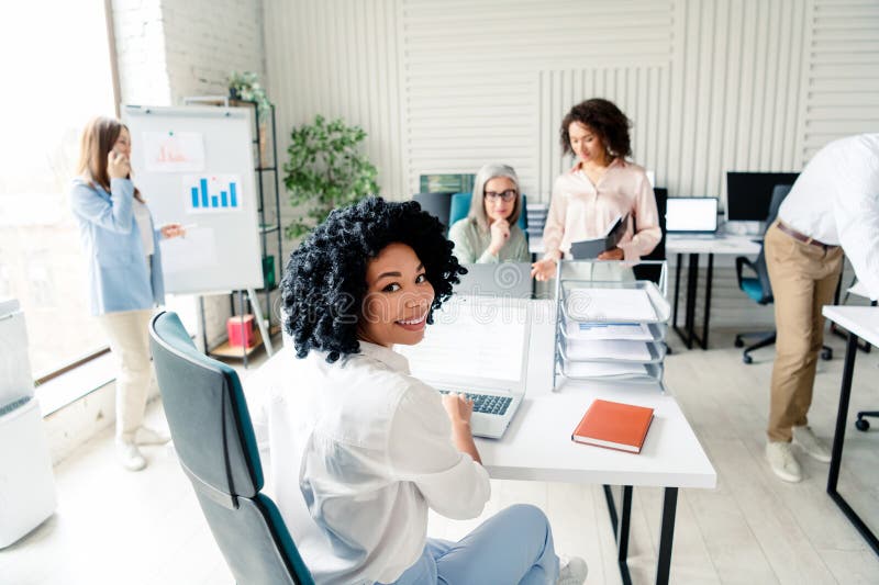 Diverse Team Working Together in Modern Office Space with Collaborative Atmosphere Stock Photo ...