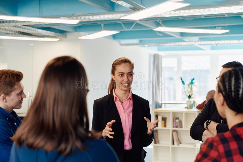 A Diverse Team of Young Business People Exchanging Ideas in a Modern ...