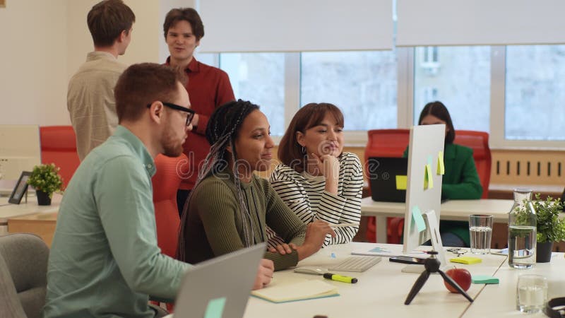 Diverse Three Colleagues Working Together Discussing Computer Project ...