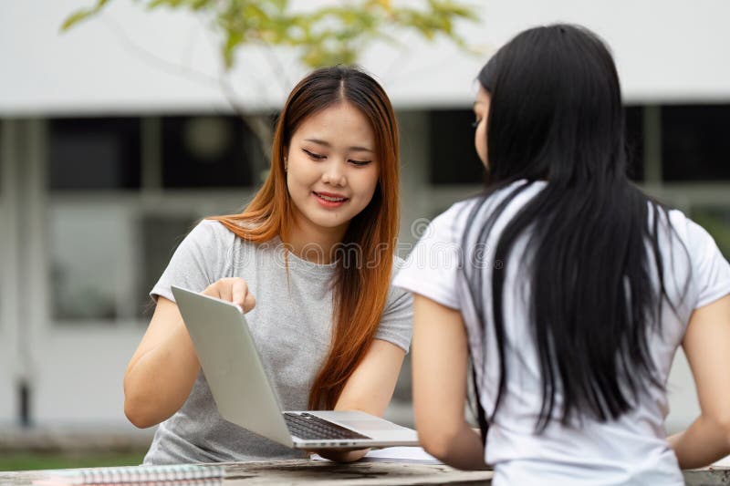 Diverse University Students Engaging in a Study Session with a Laptop ...