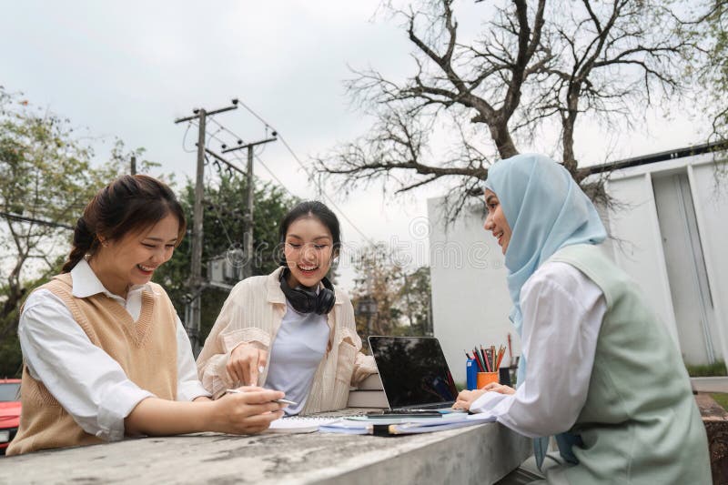 Diverse University Students Happily Collaborating and Studying Together ...