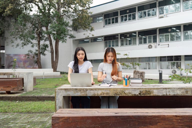 Diverse University Students Studying Together Outdoors at a Campus ...