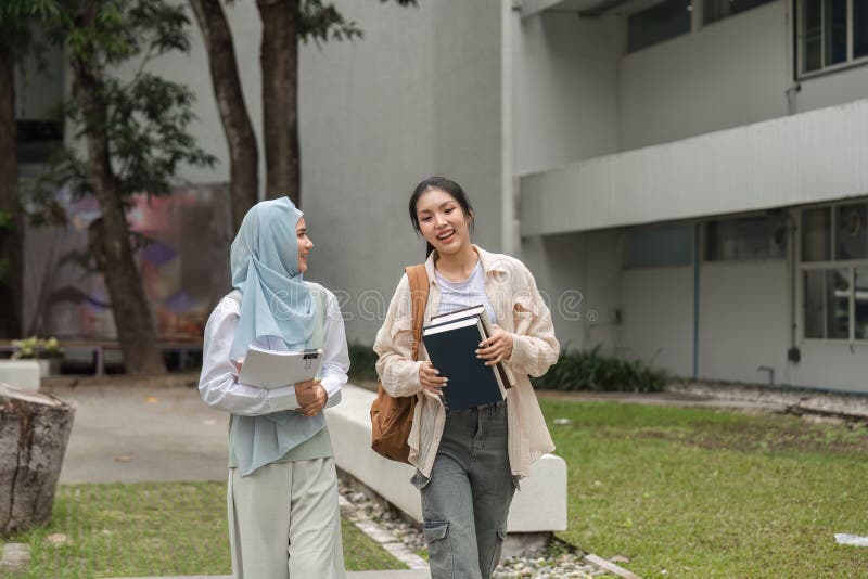 Diverse University Students Walking and Chatting Together on Campus ...