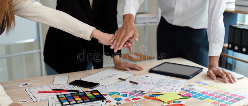 United UX UI Design Team Placing Hands Together in Support during a ...