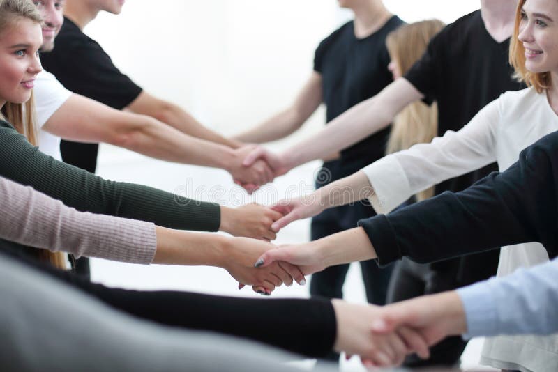Diverse Young People Shaking Hands with Each Other Stock Image - Image ...
