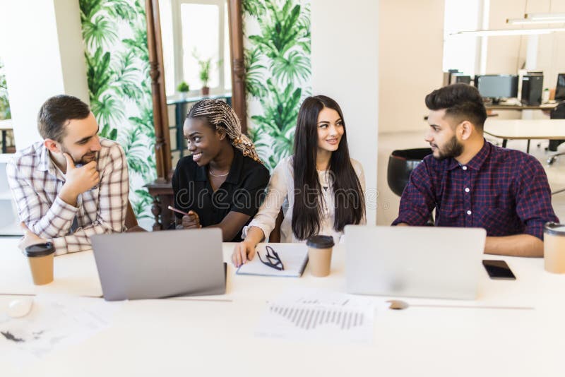 Diverse Young and Senior Office Workers Collaborating and Talking ...
