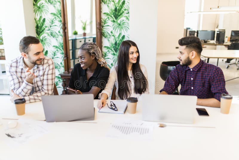 Co-workers Collaborating on Blueprints Stock Image - Image of ...