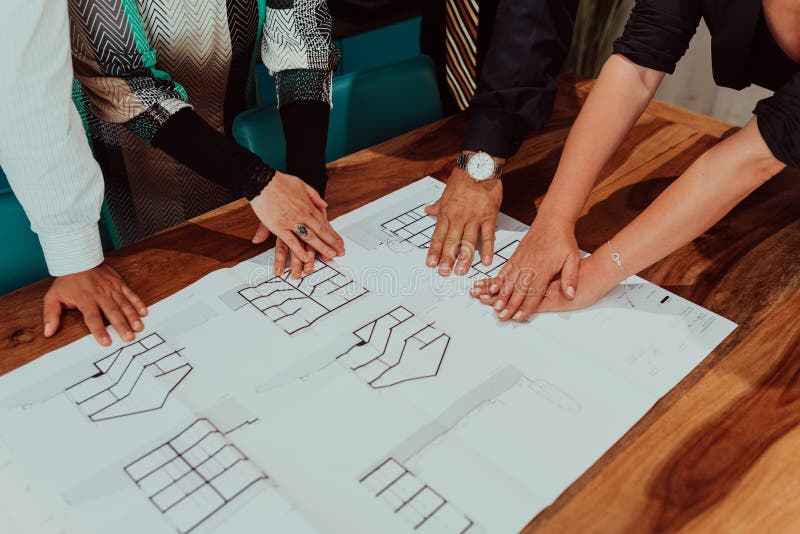 Diversity Group Working Together on Architectural Project in Office ...