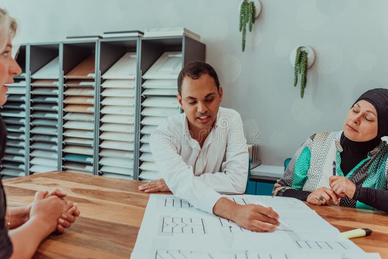 Diversity Group Working Together on Architectural Project in Office ...