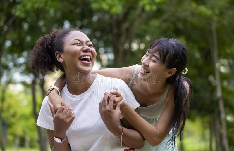 Diversity Of Lgbtq Lesbian Couple Is Laughing And Hugging Each Other