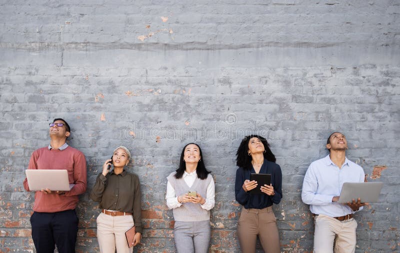 Diversity, Technology and Team Standing at Wall Looking Up and Working ...