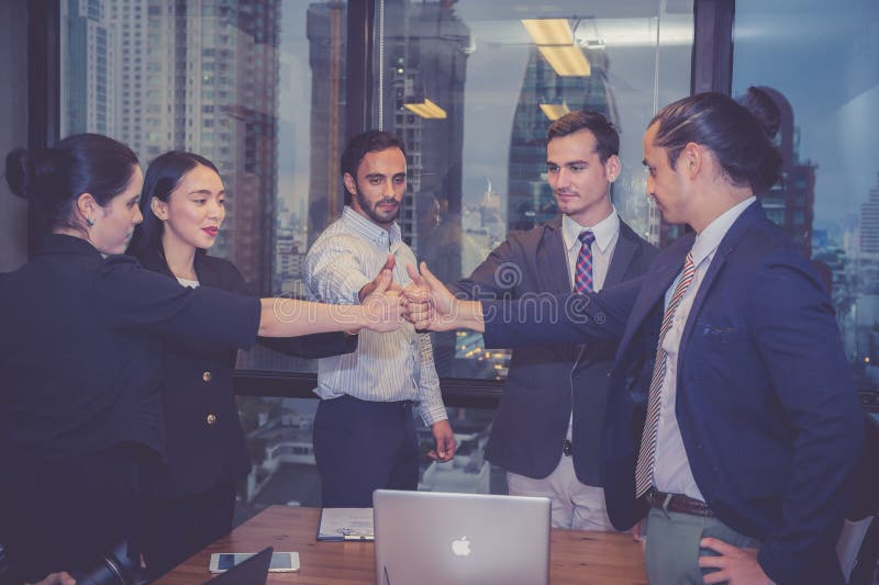 Diversity Young Business Team Giving Thumbs Up In Modern Office With