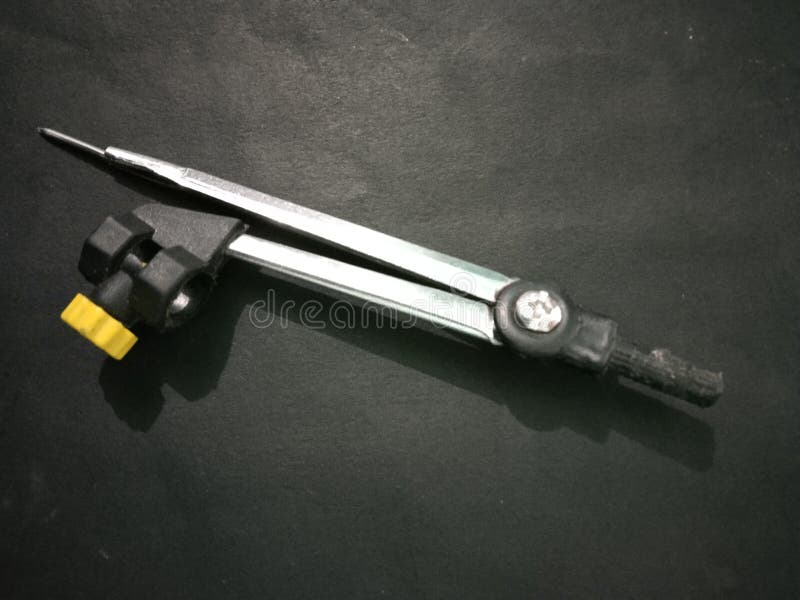 Divider Mathematics Tools on Black Background Stock Photo - Image of ...