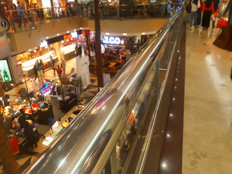 Dividing the Second Floor with the First Floor in a Shopping Center, in ...