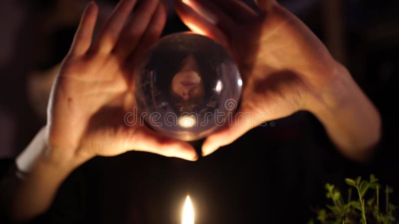 Divination on a Crystal Ball Next To Burning Candles Stock Video ...