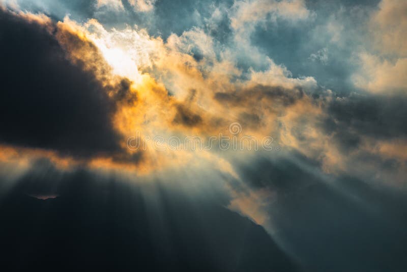Divine Rays of Sun between the Clouds Stock Image - Image of revealed ...
