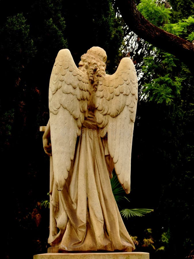 Angel statue on graveyard stock photo. Image of grave - 52611238