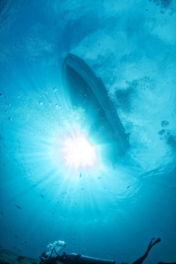 Diving Boat Ship from Underwater Blue Ocean with Sun Rays Stock Photo ...
